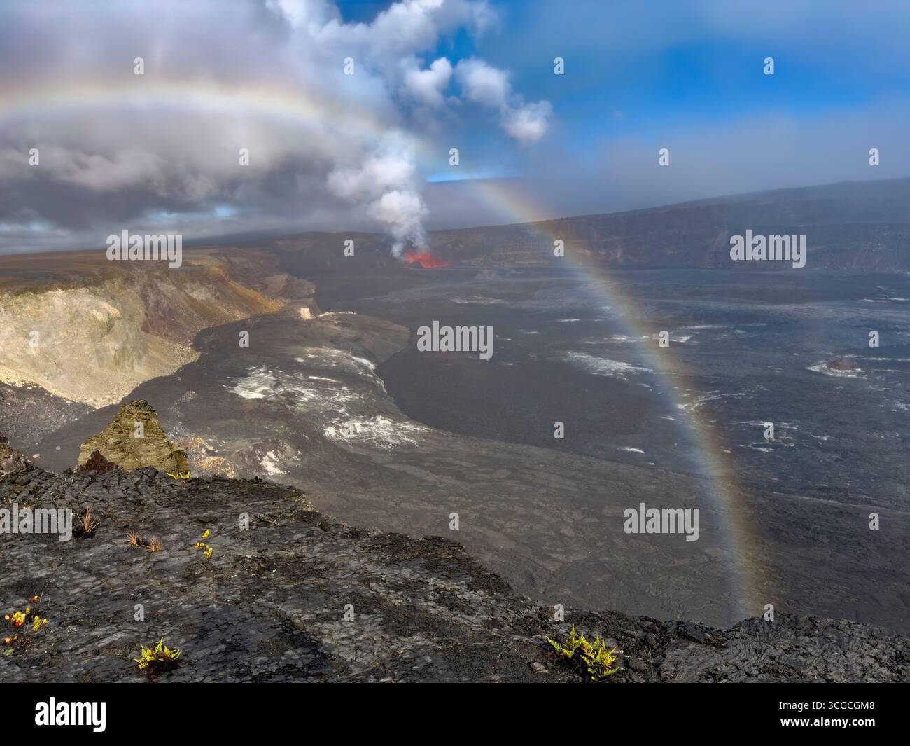 a rainbow arcs over a fountain of hot lava erupting from the caldera of ...