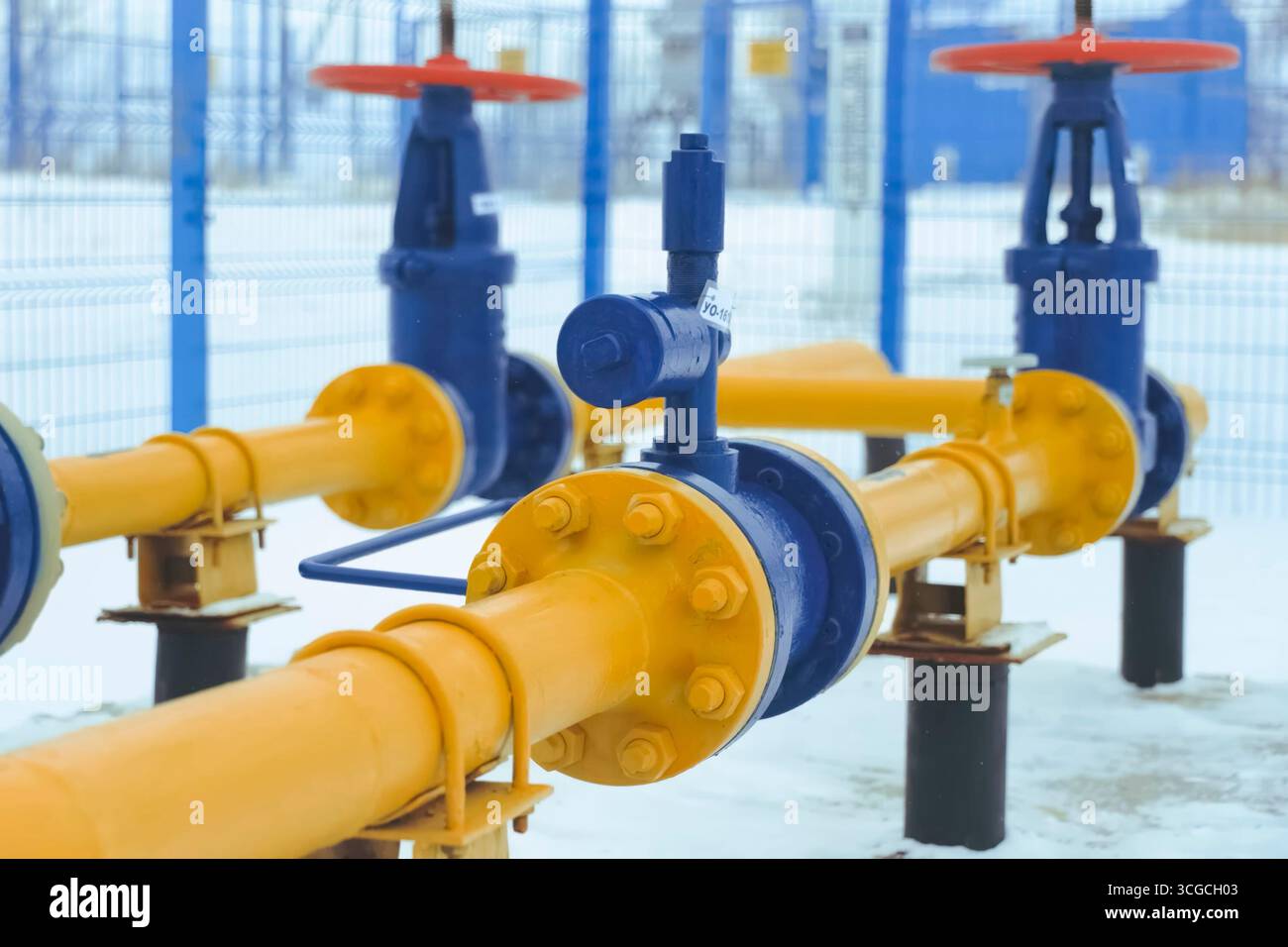 shut-off valves on an oil and gas pipeline, painted blue and red Stock ...
