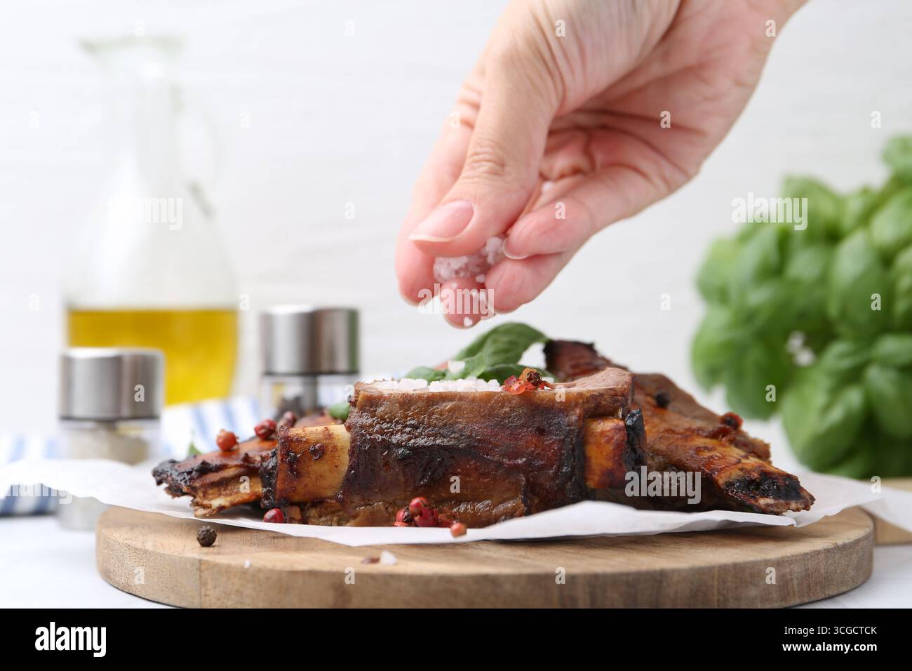 Woman salting roasted beef hi-res stock photography and images - Alamy