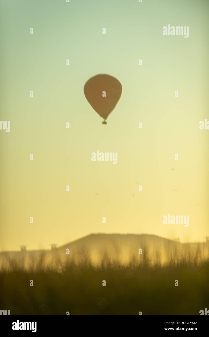 side road with hot air balloon floating Stock Photo - Alamy