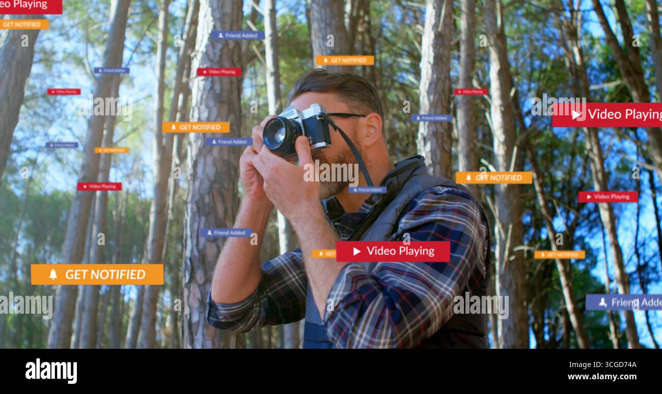 Aiming photographer shooting film camera in pine forest, with ...