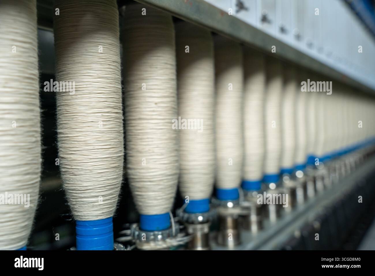 Multiple Yarn Cones Wound with Precision in Textile Production Stock ...
