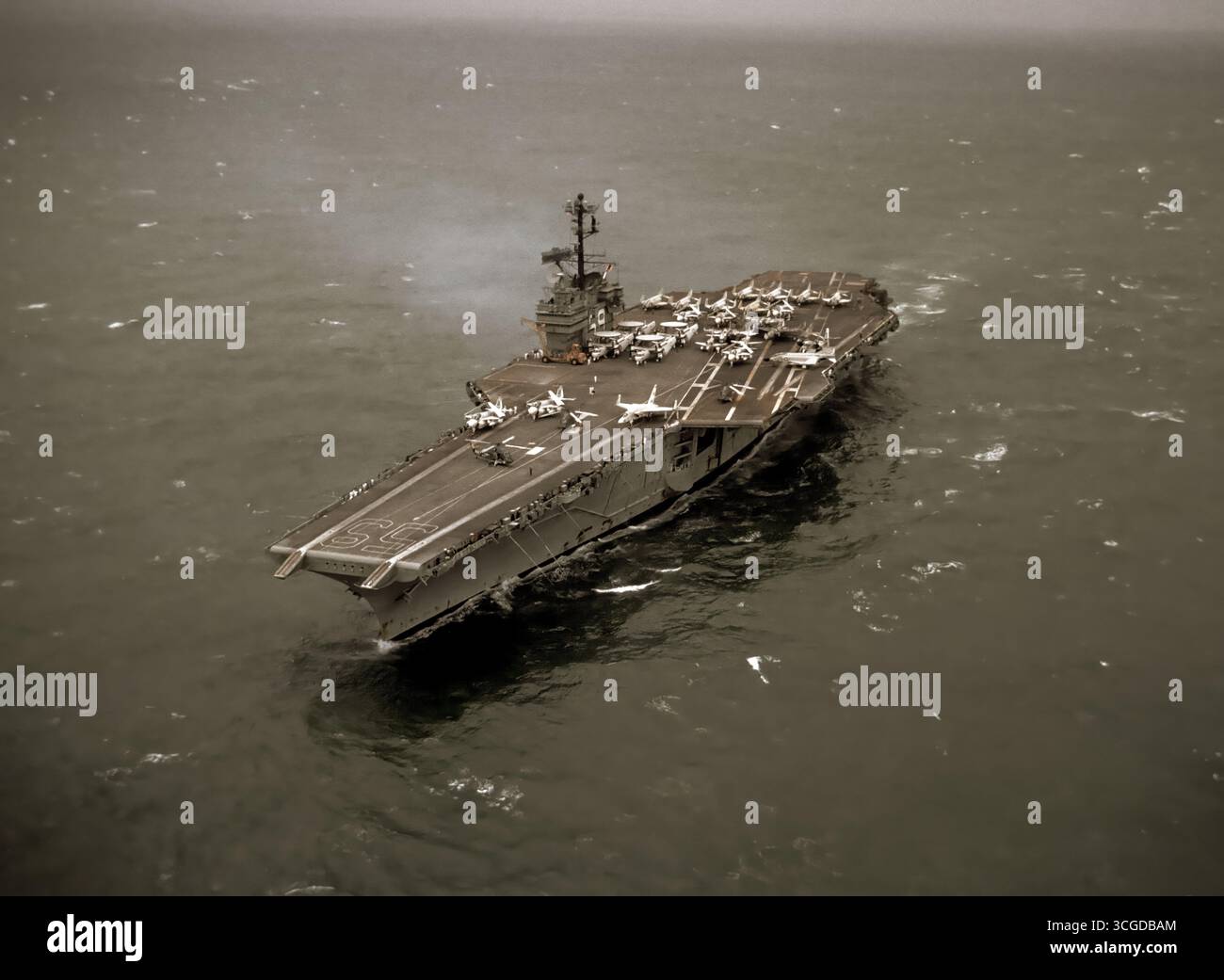 An aerial port bow view of the Forrestal Class Aircraft Carrier, USS ...