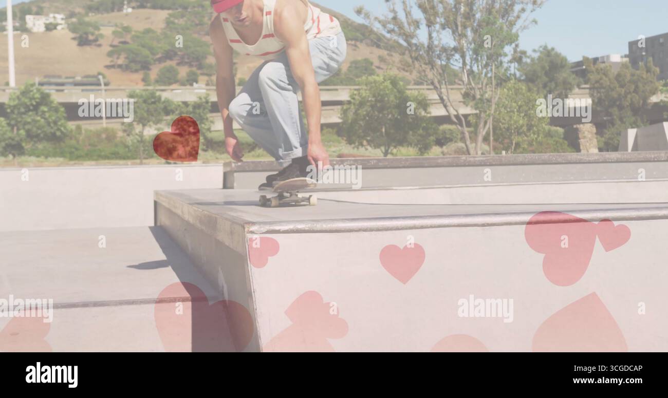 Crouching skater in red baseball cap descending concrete ramp on ...