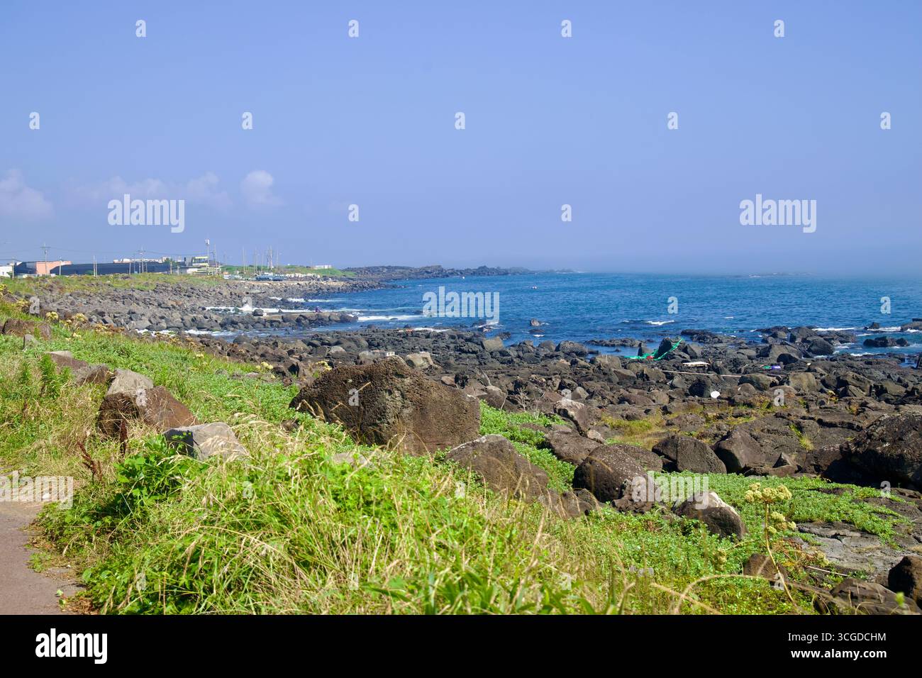 Basalt boulder shore along the Yeongnak coast on Jeju’s west side, with ...