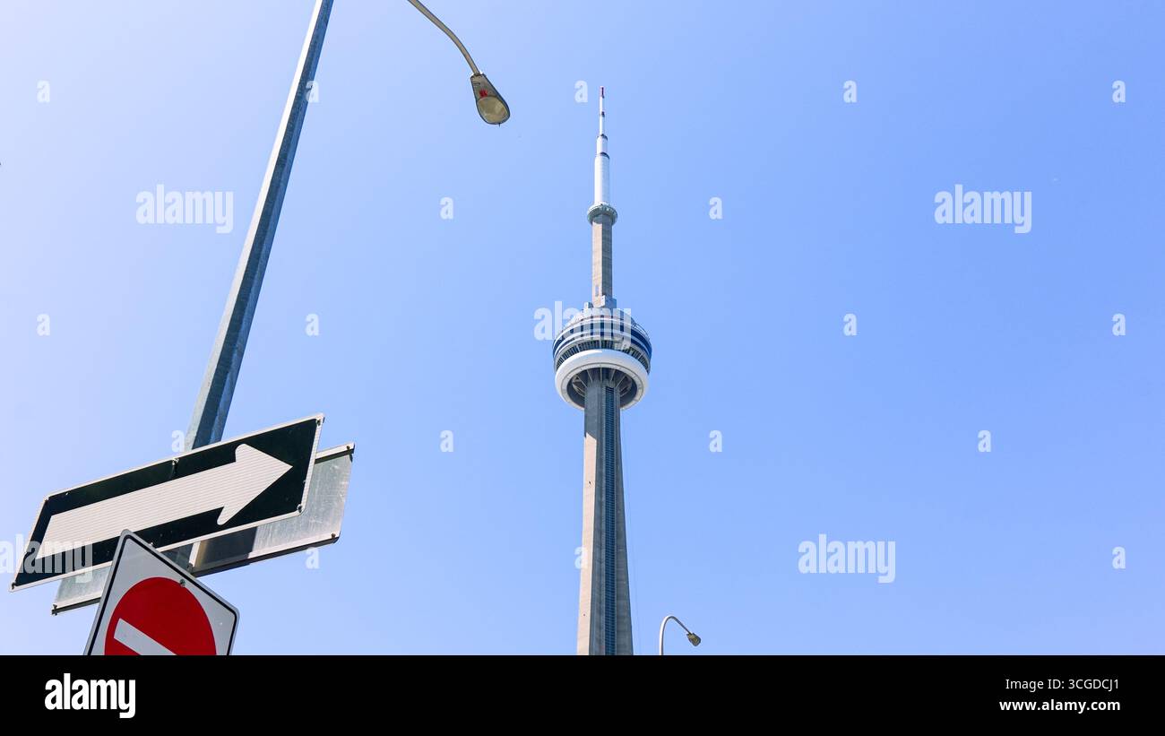 Iconic Toronto CN Tower observation tower rising against a clear blue ...
