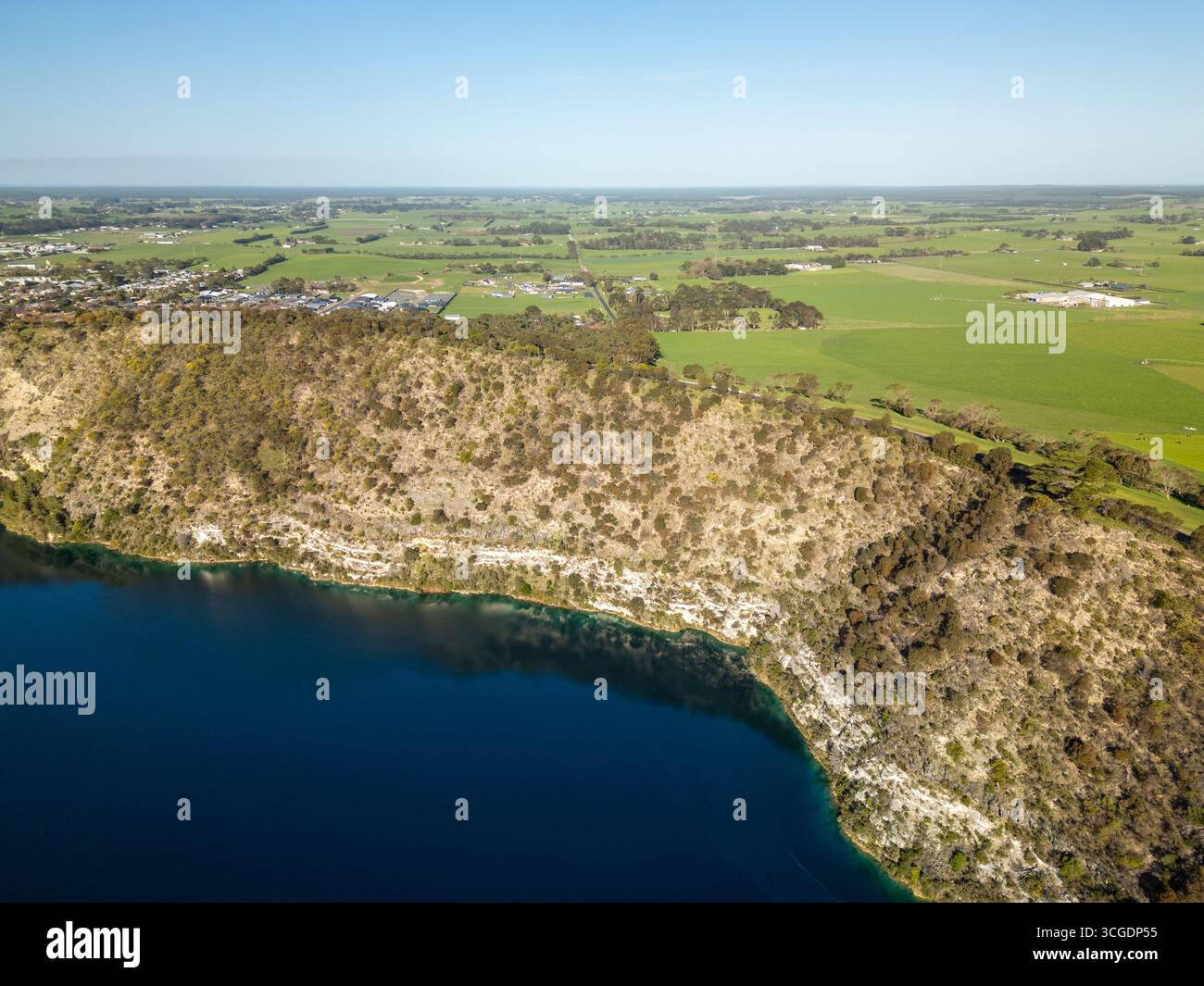 Aerial view of the Blue Lake's deep blue waters contrasting with the ...