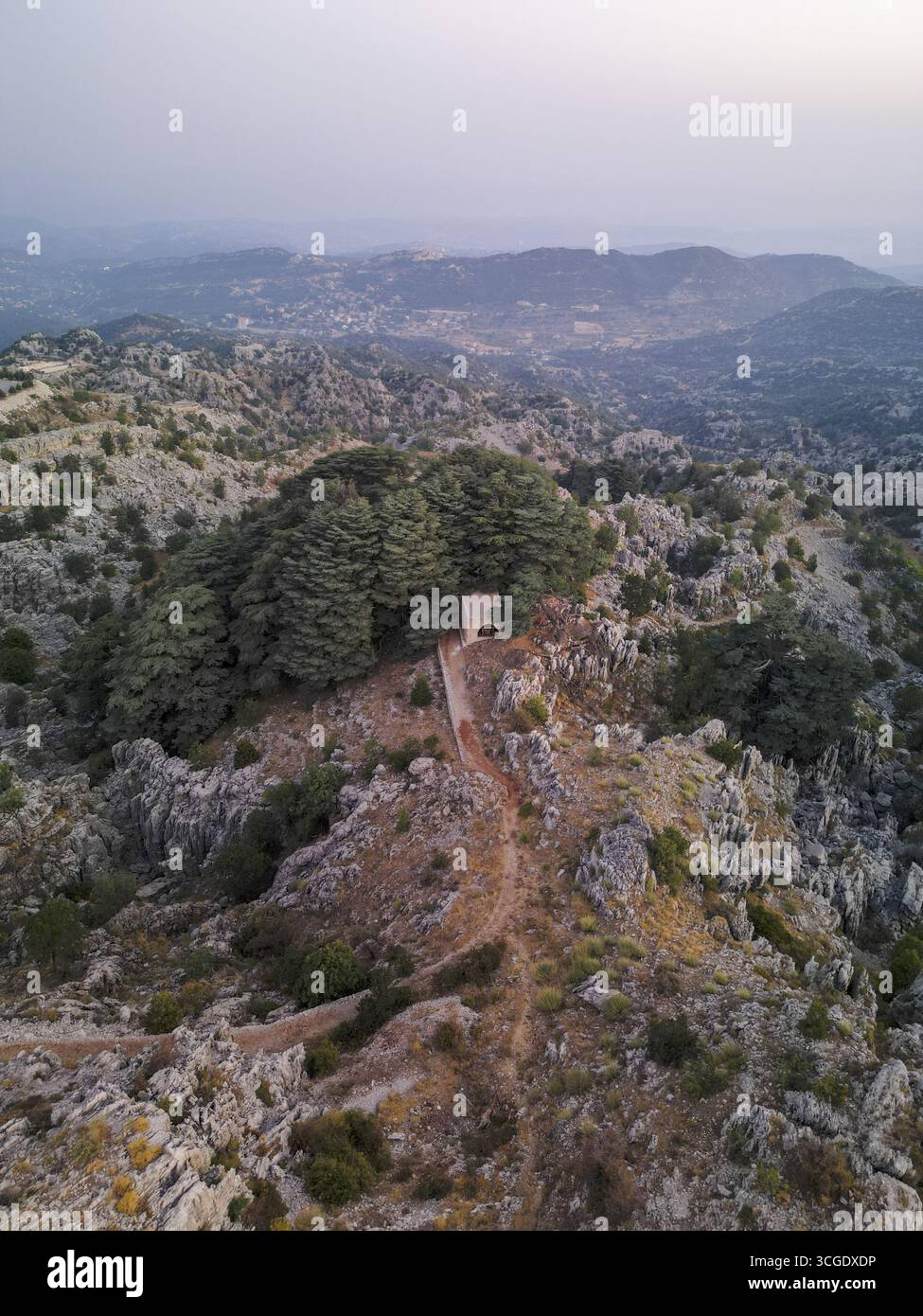 Aerial view of a winding path cutting through rocky terrain, leading ...