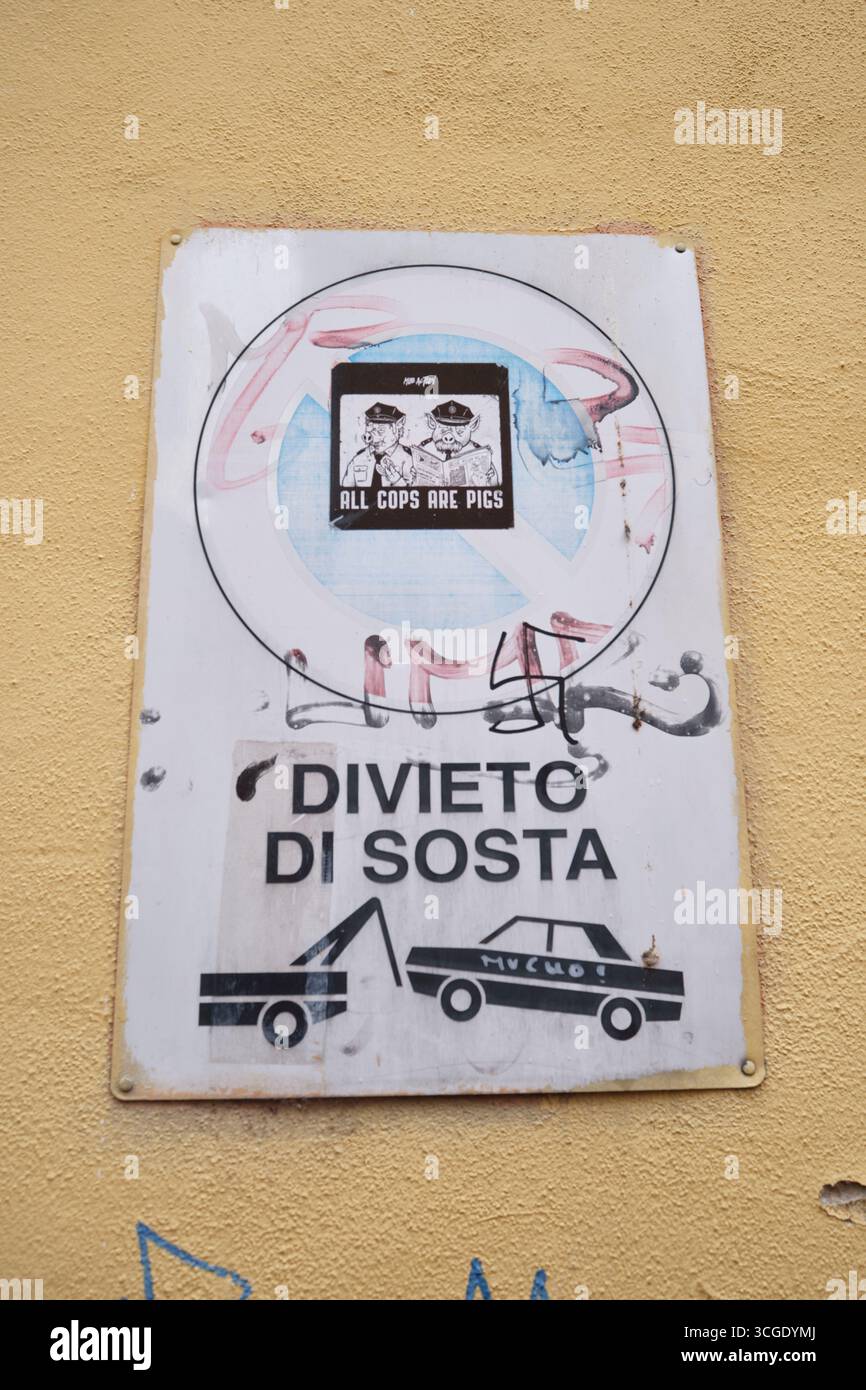 A No Parking, Tow Zone sign with an All Cops Are Pigs sticker. Street ...