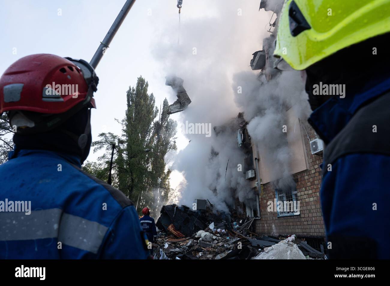 Ukrainian emergency services are seen at the site of an overnight air ...