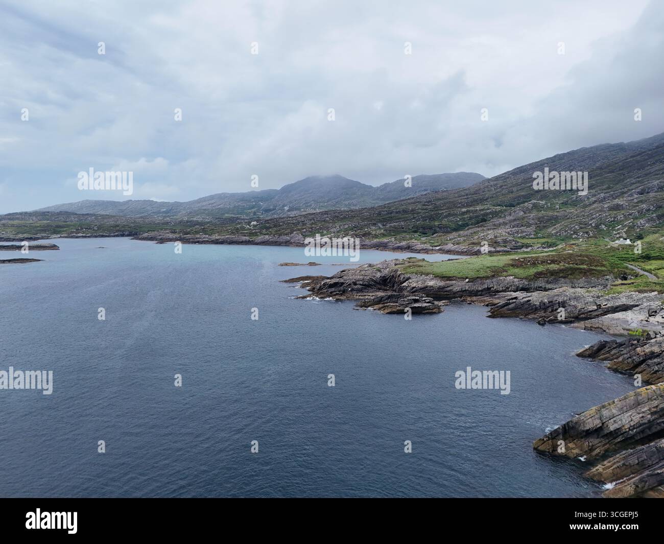 Cork, Ireland - 13th July 2025 - Aerial view of cliffs and the sea on ...