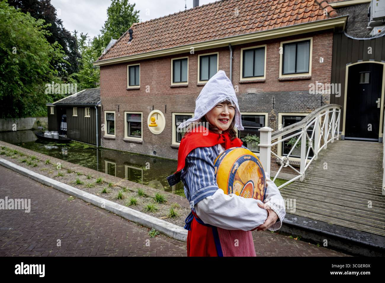 GOUDA - Tourists visit the Gouda cheese market. For several centuries ...