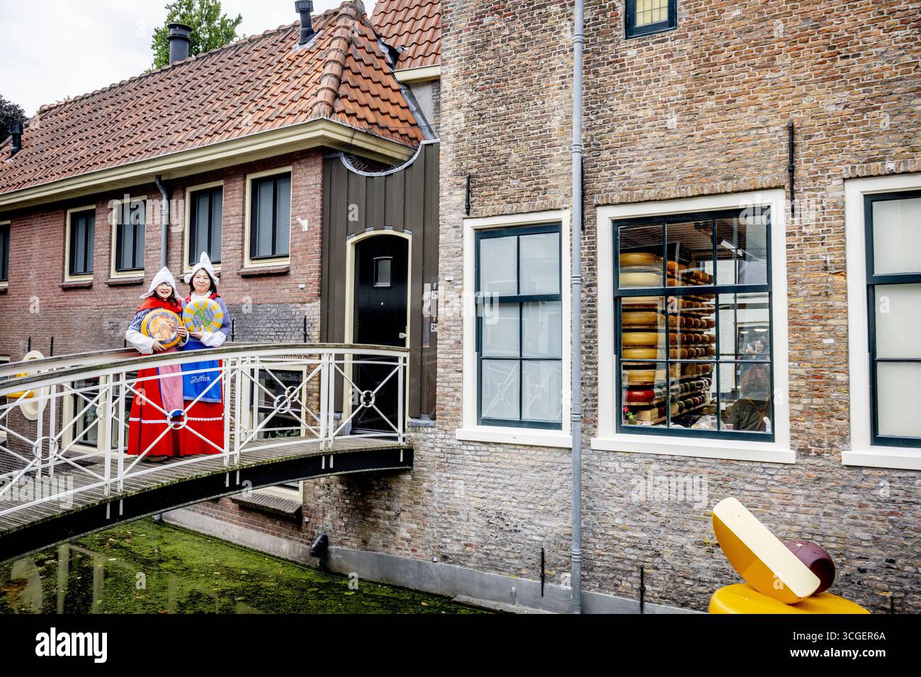 GOUDA - Tourists visit the Gouda cheese market. For several centuries ...