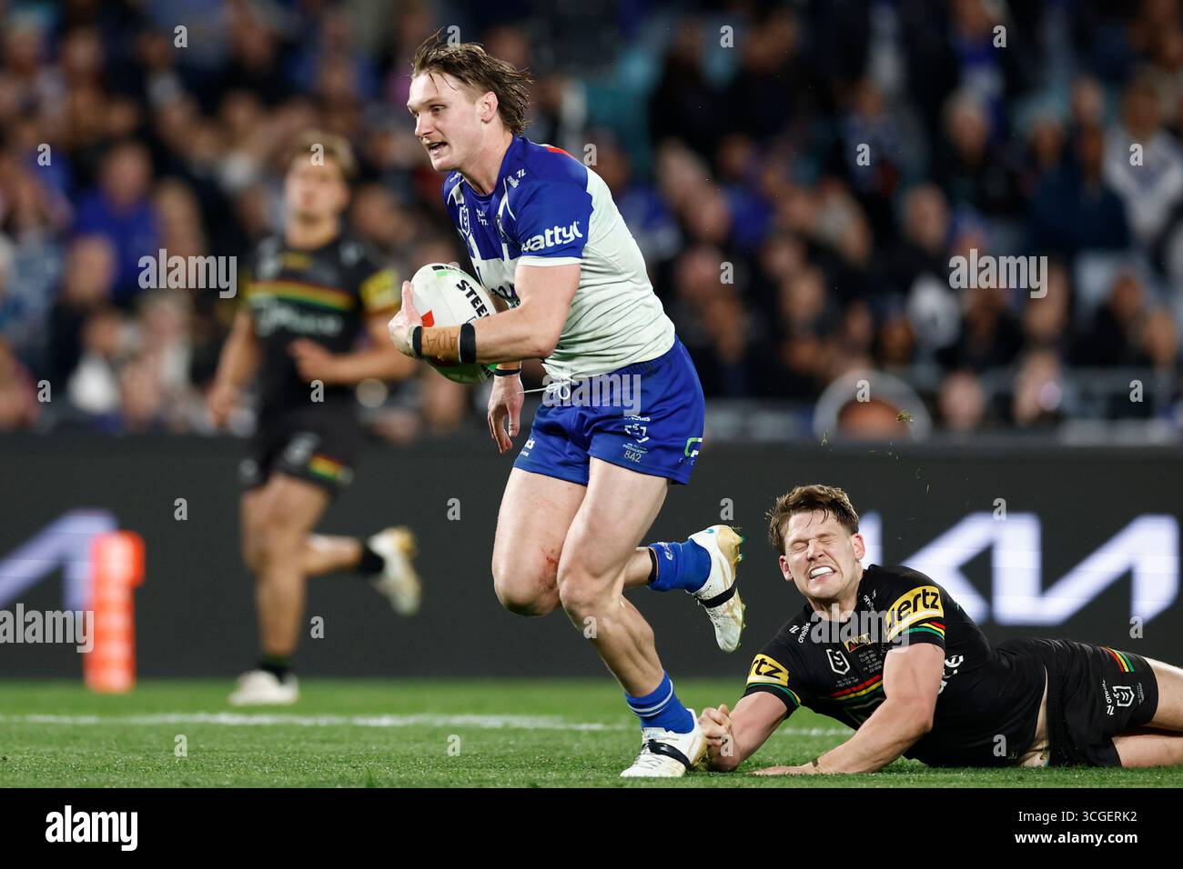 Jacob Preston of the Bulldogs on his way to scoring his third try with ...