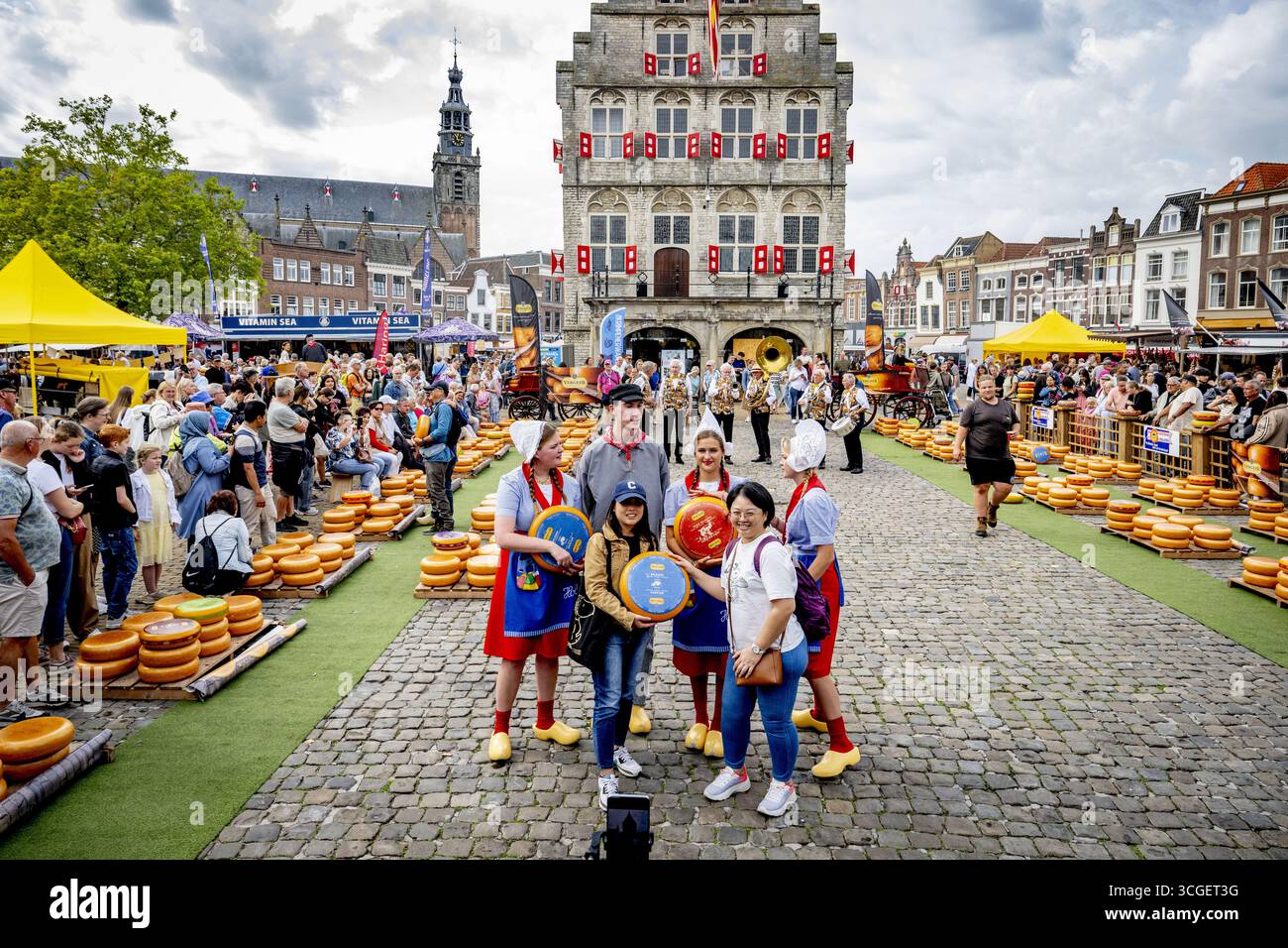 GOUDA - Tourists visit the Gouda cheese market. For several centuries ...