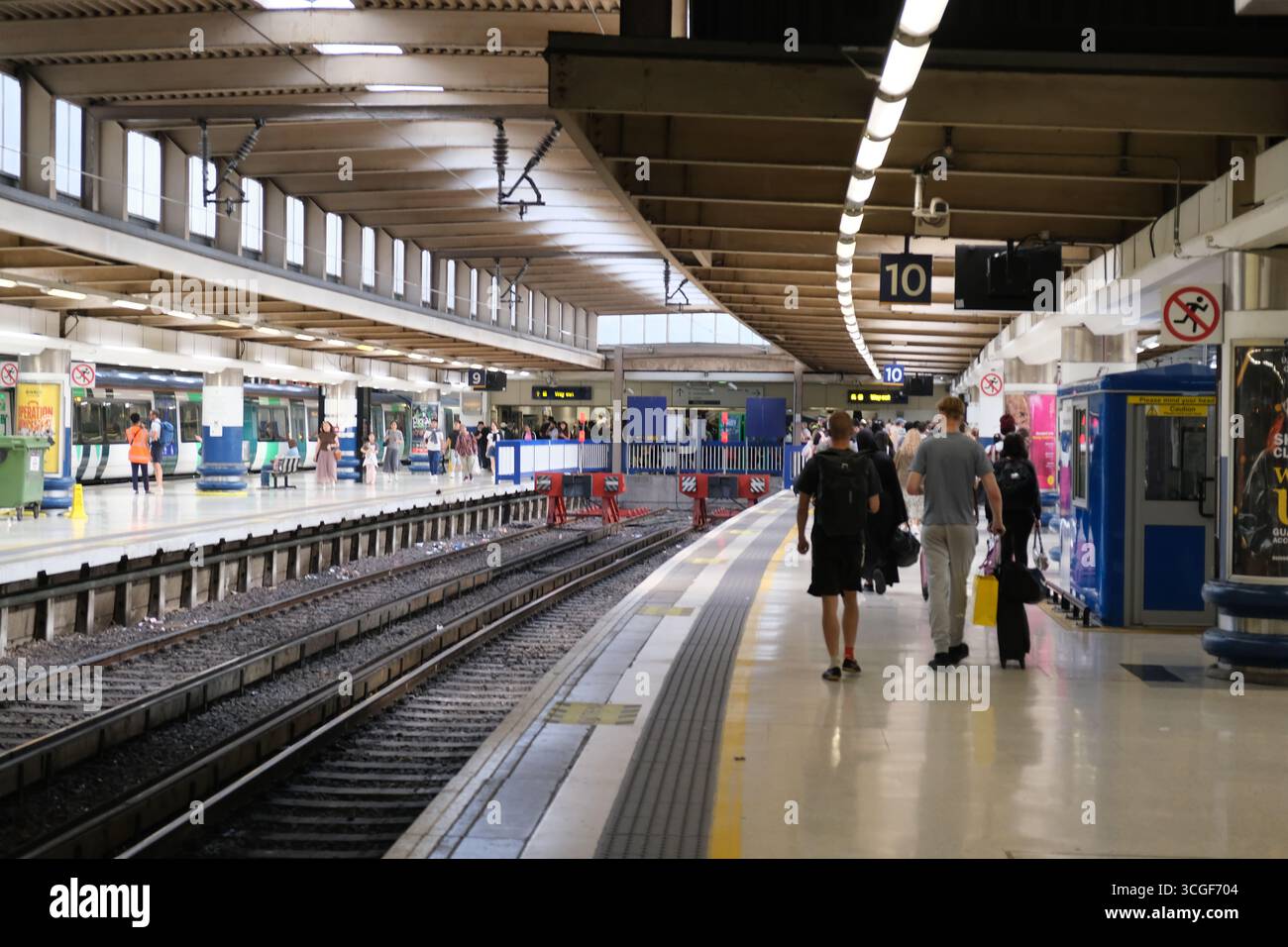People walk down platform 10 in Euston railway station, London Stock ...