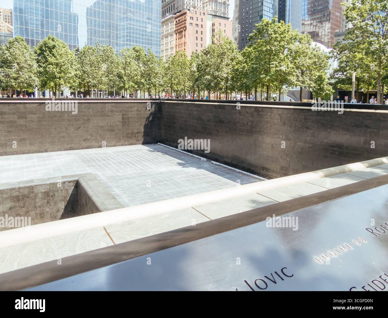 NEW YORK, USA - July 6, 2025: The iconic 911 Memorial site on a clear ...