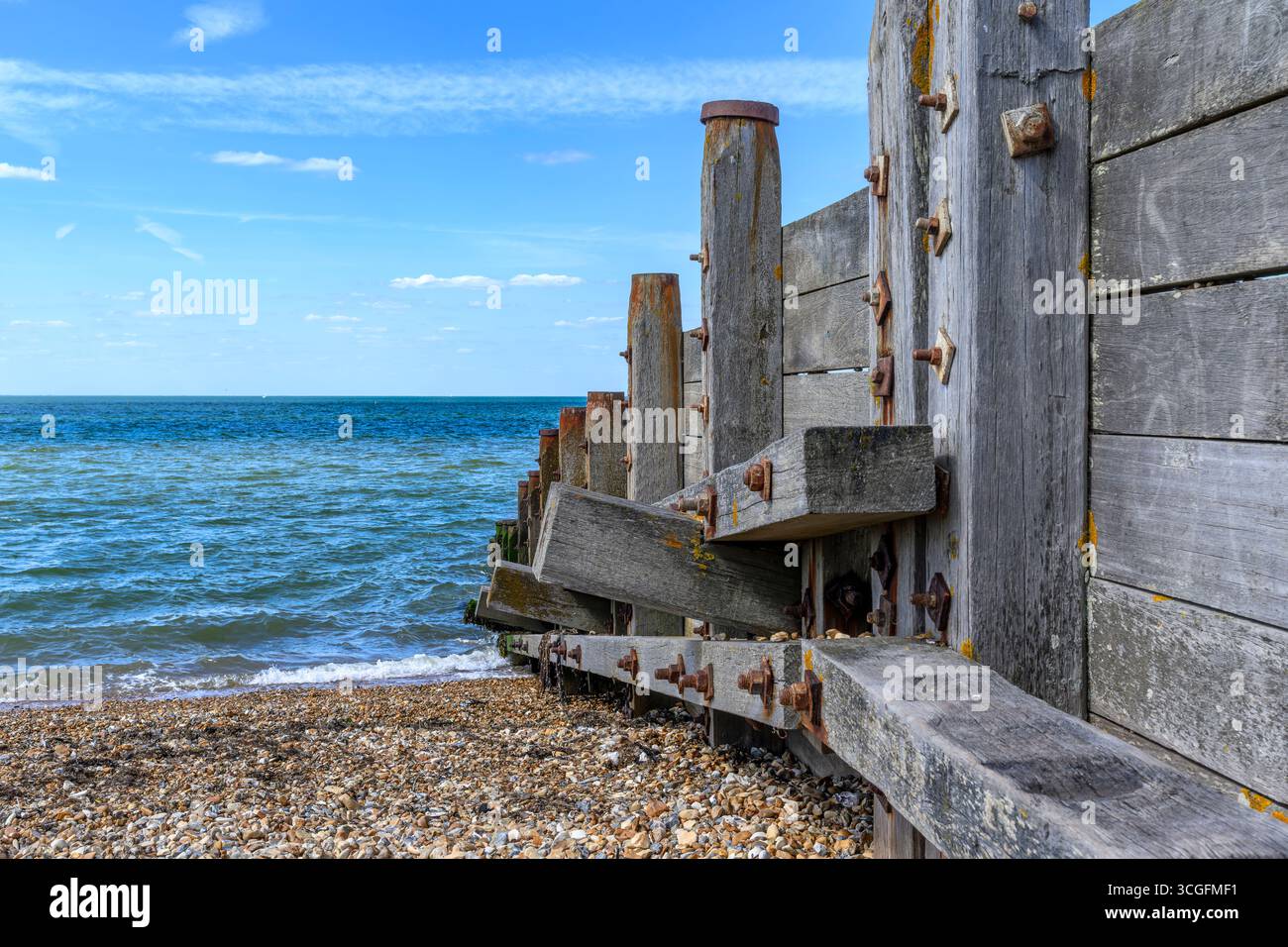 Old wooden groins (or groynes) used to protect the shingle beach from ...