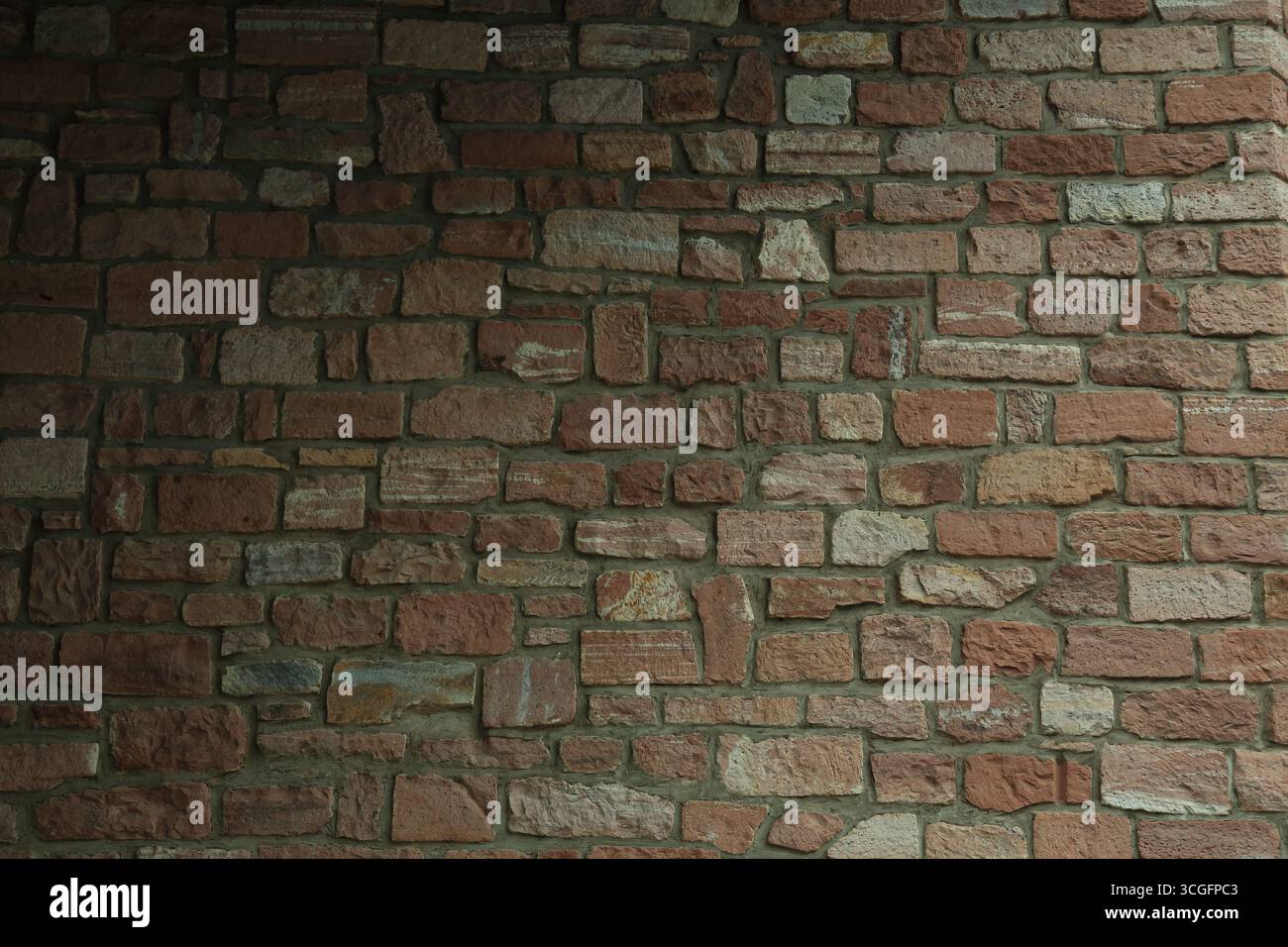 Textured sandstone brick masonry wall surface Stock Photo - Alamy