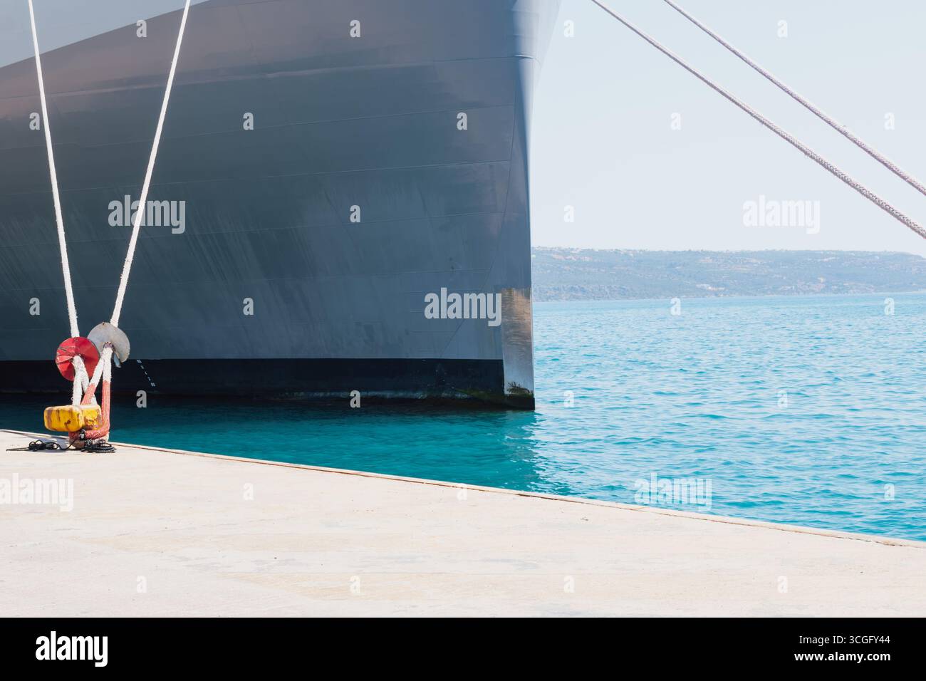 Mooring of a vessel in the port using mooring lines to a bollard on the ...