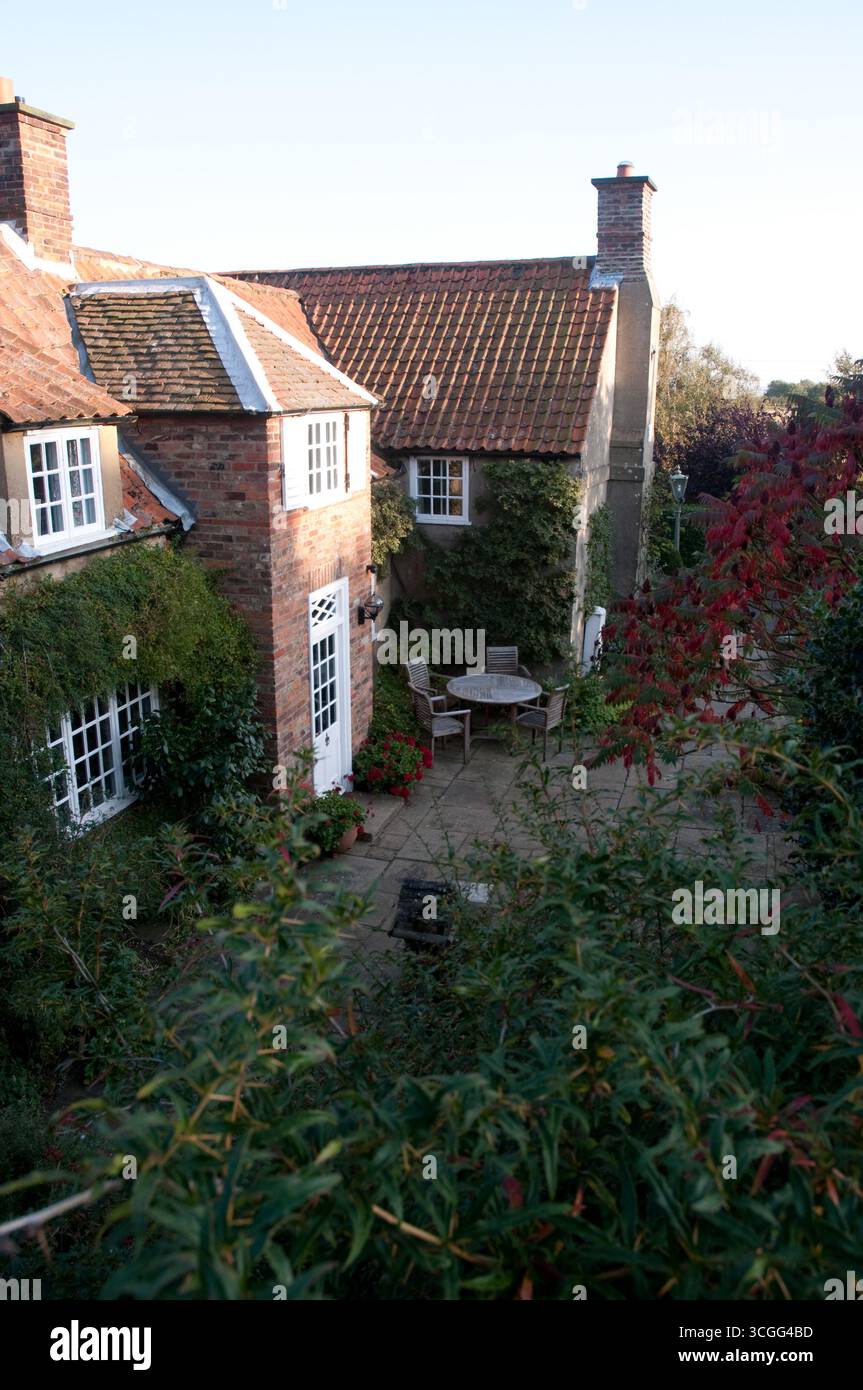 A picturesque countryside residence featuring ivy-covered walls, a ...