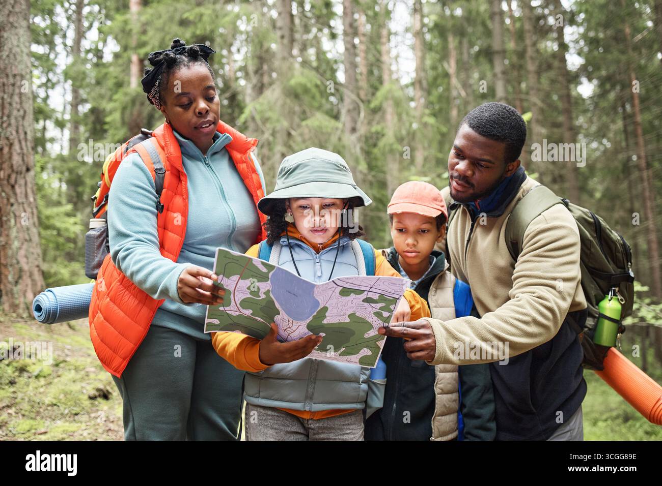 Black Family with Children Navigating Forest Trail Using Map during ...