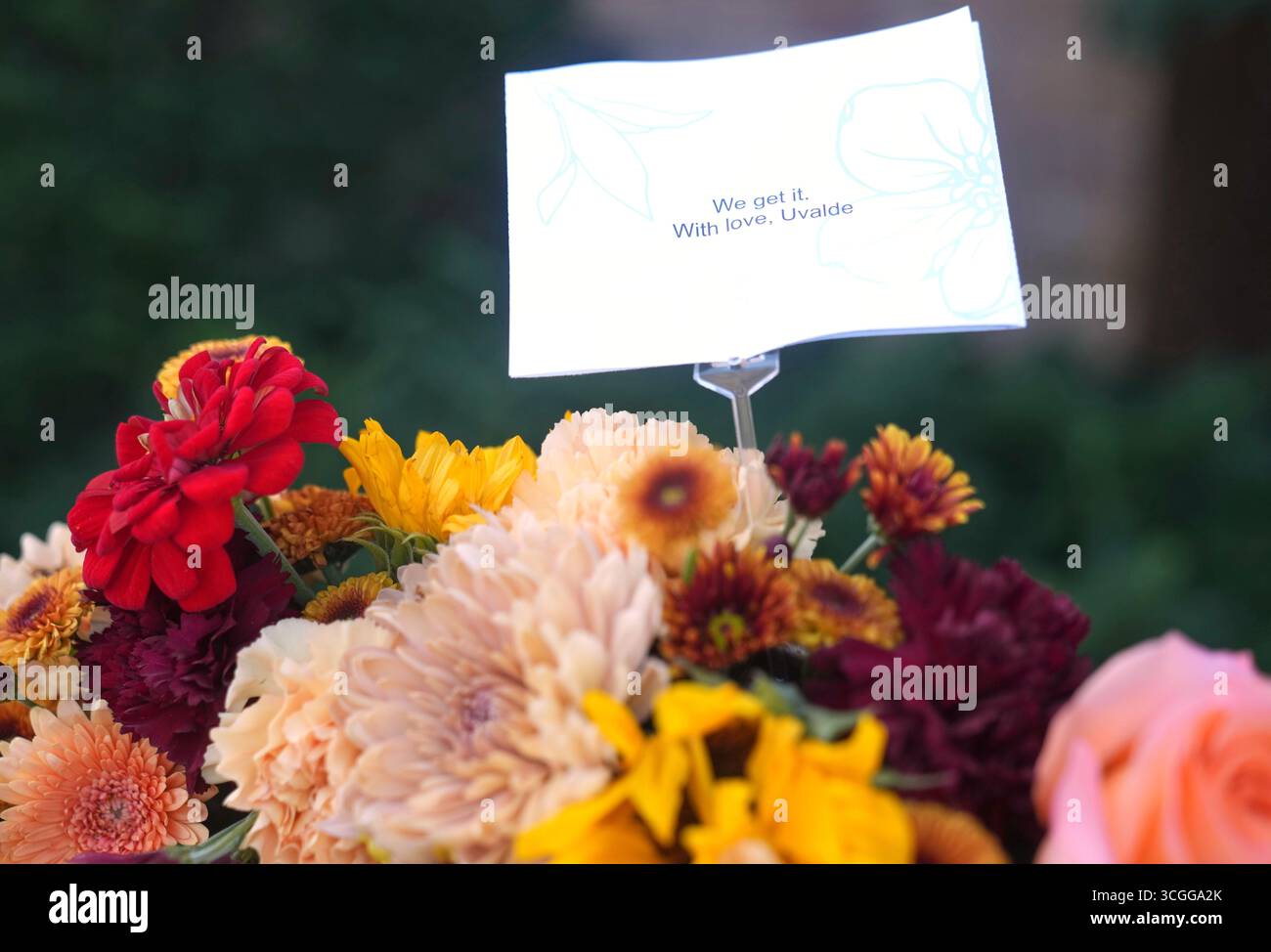 Flowers are left on behalf of families of victims of the Robb ...