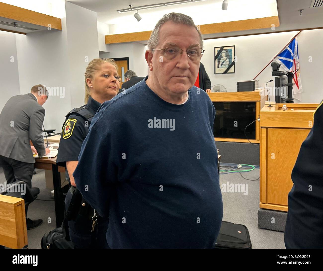 Anthony Humby is led out of a provincial court room in St. John's, N.L ...