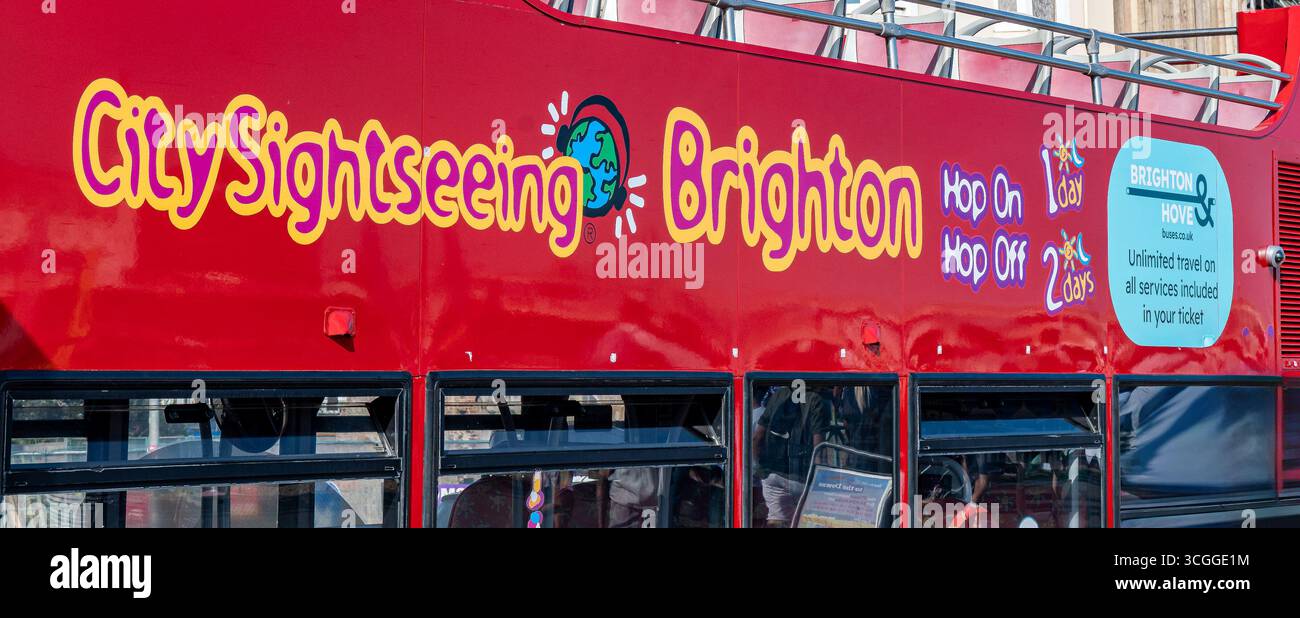 Bright red Brighton sightseeing hop on, hop off, bus Stock Photo - Alamy