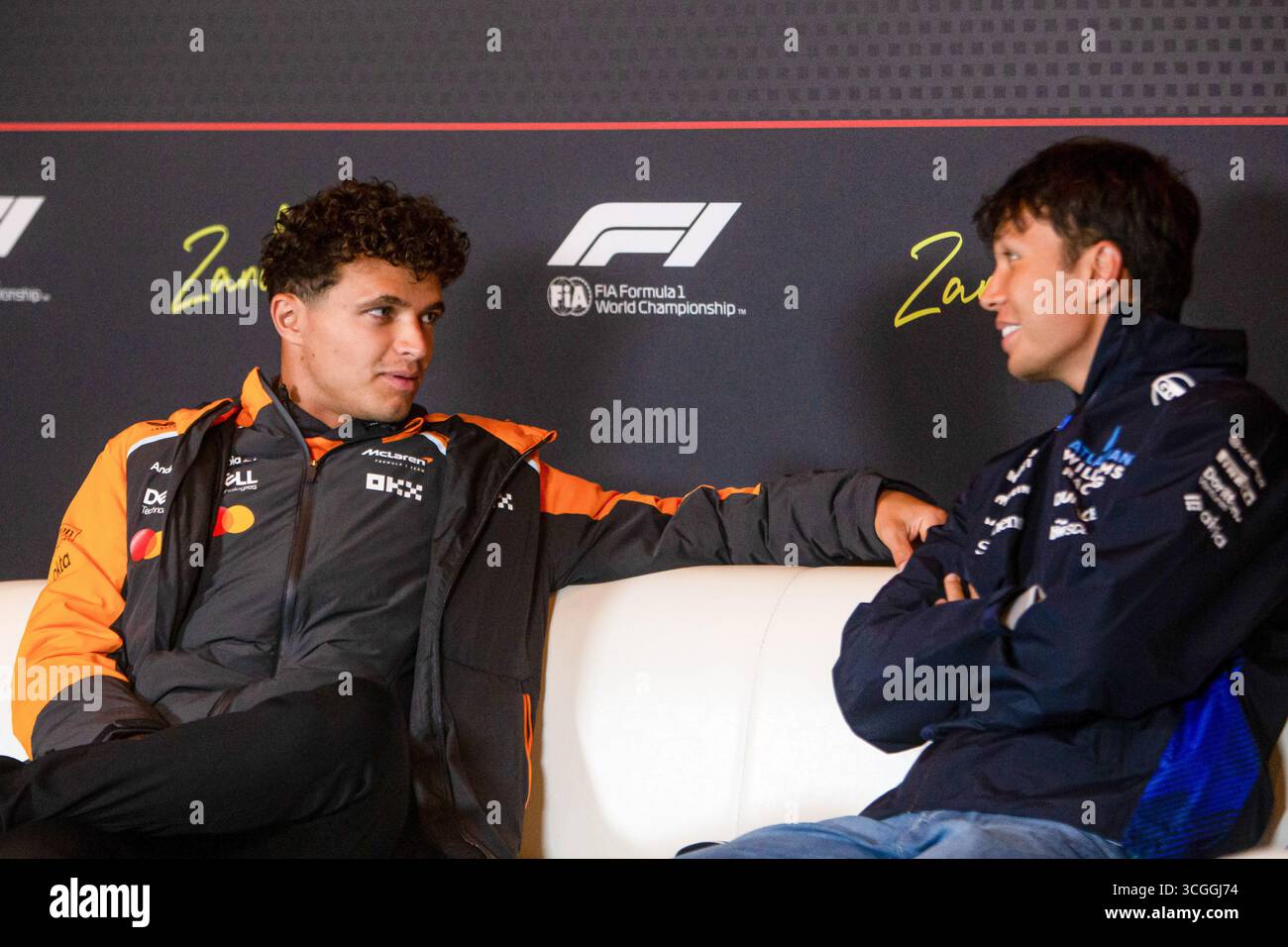 Zandvoort, Netherlands. 28 Aug, 2025. Lando Norris and Alexander Albon ...