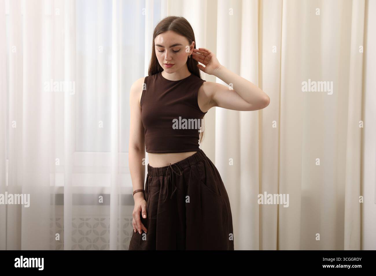 Posing at window hi-res stock photography and images - Alamy