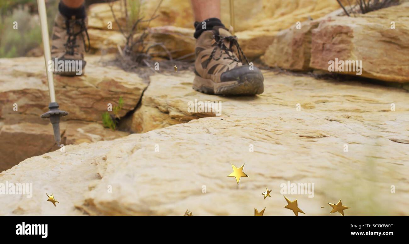 Stepping hiker's lower legs clad in hiking boots across layered ...