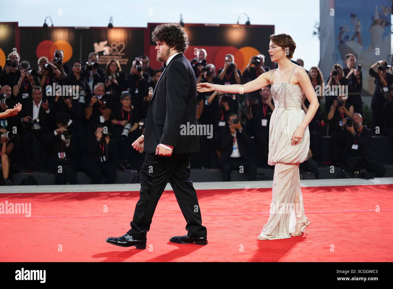 Aidan Delbis, left, and Emma Stone pose for photographers on the red ...
