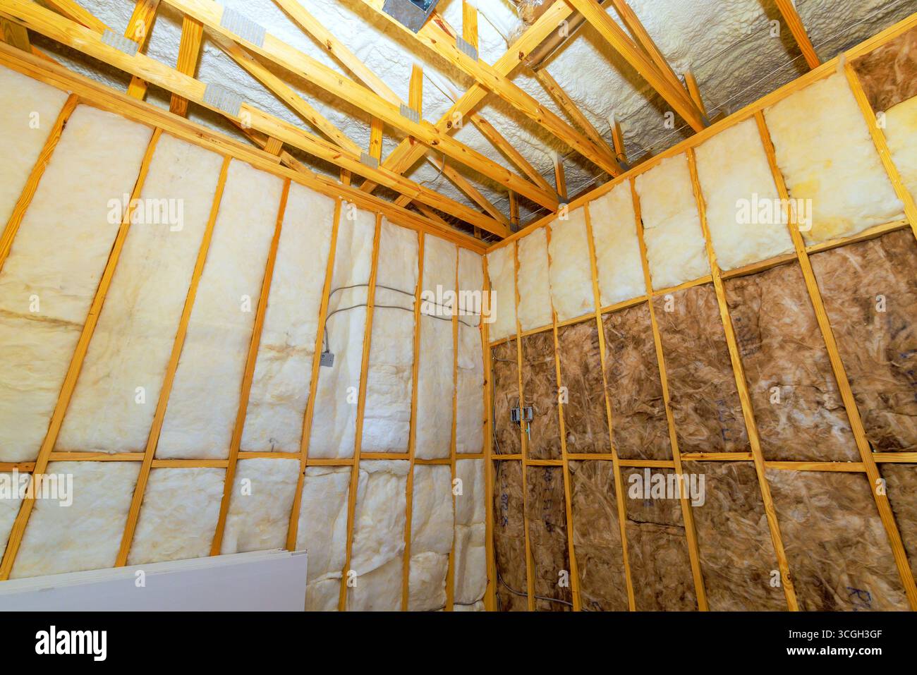 Workers insulate room with soundproofing material in new home build ...