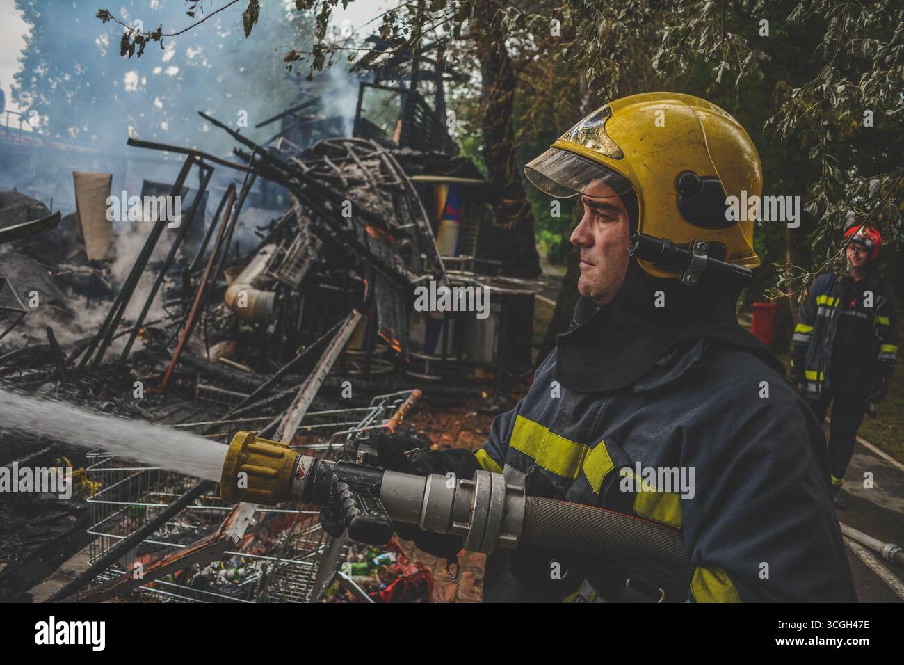 Firefighters extinguishing a fire in Belgrade, Serbia Stock Photo - Alamy