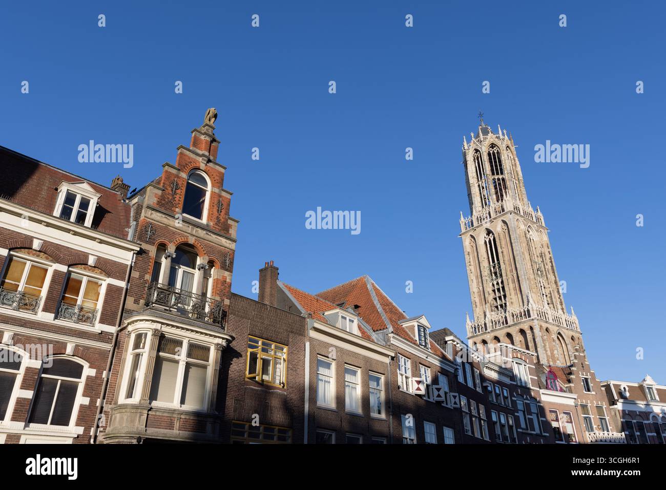A classic low-angle view showcasing the varied gabled rooftops of ...