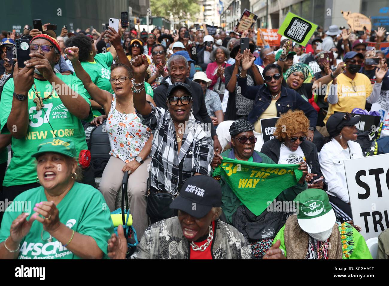 Protesters cheer as they listen to speeches for the March on Wall ...