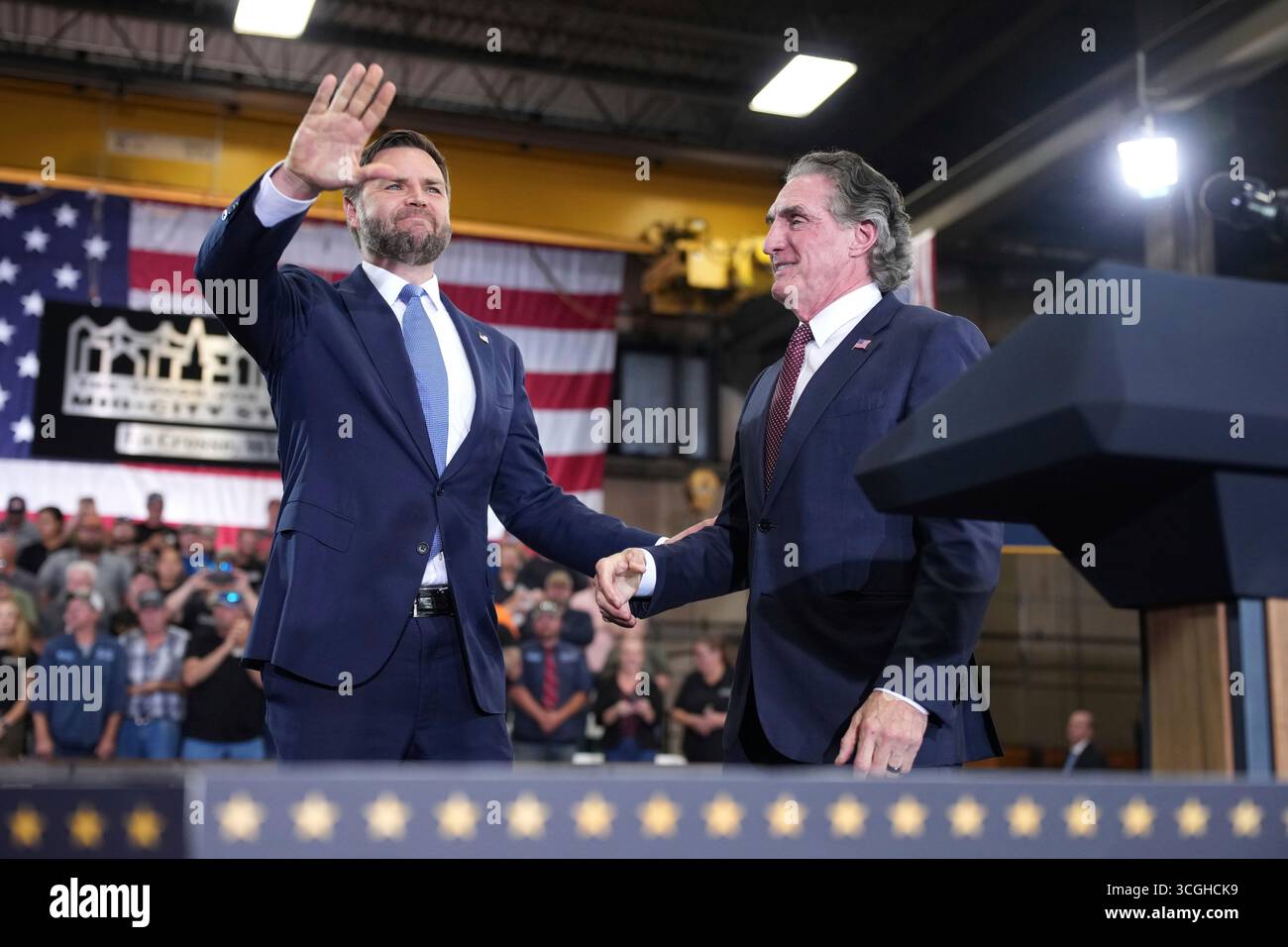 Vice President JD Vance, left, is introduced by Interior Secretary Doug ...