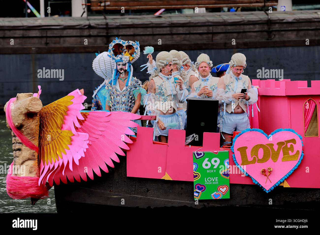 Pride Amsterdam Canal Parade float with pink LOVE castle, feathered ...