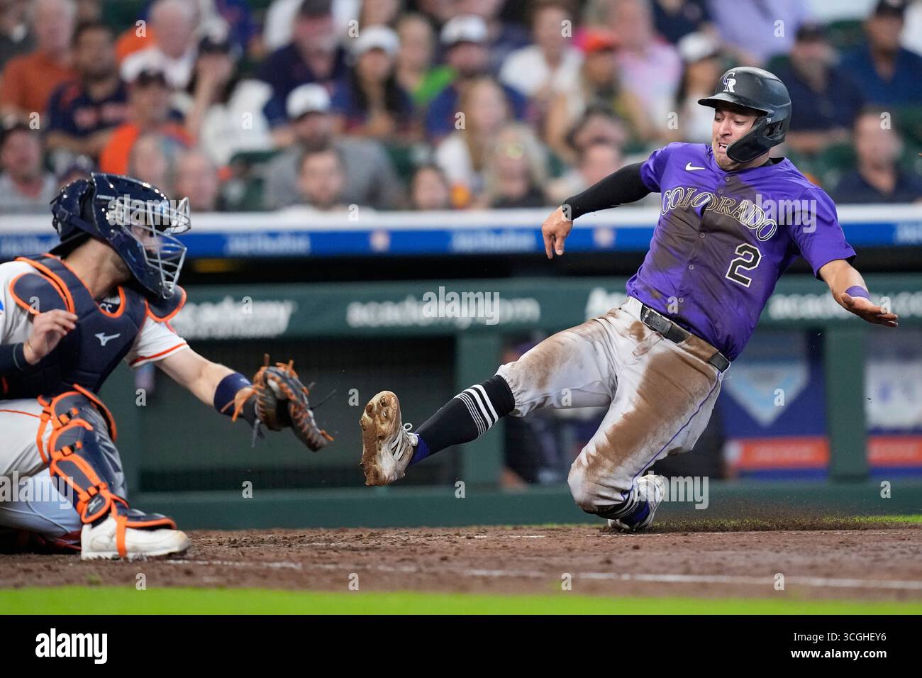 Colorado Rockies' Tyler Freeman (2) is tagged out at home plate by ...