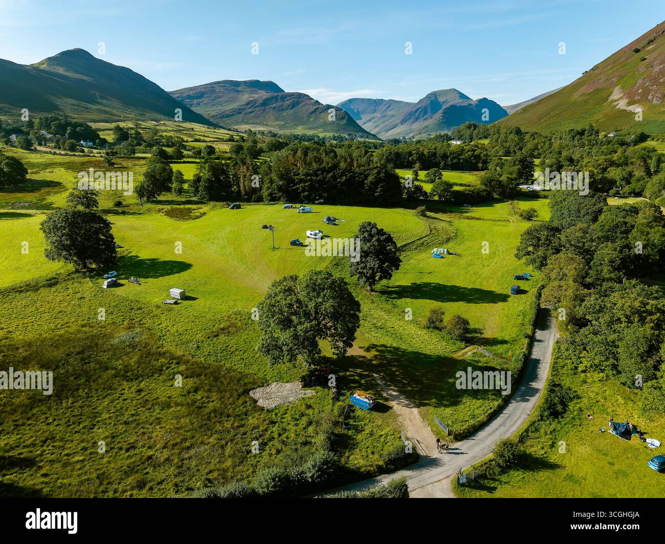 Aerial drone view of a pop-up campsite in a green valley in the Lake ...