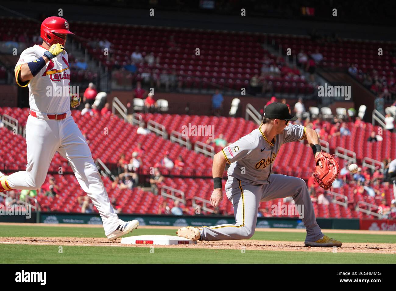 St. Louis Cardinals' Lars Nootbaar, left, is safe at first for a single ...
