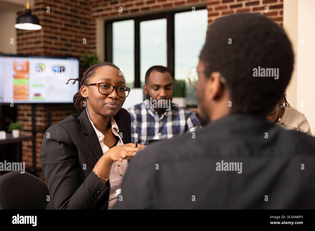 Female project manager talks data hi-res stock photography and images ...