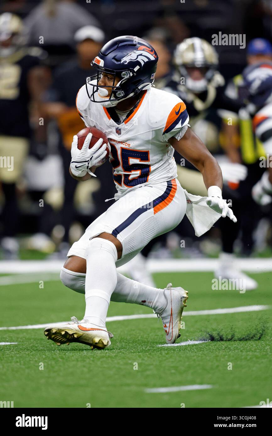 Denver Broncos running back Blake Watson (25) runs the ball during an ...