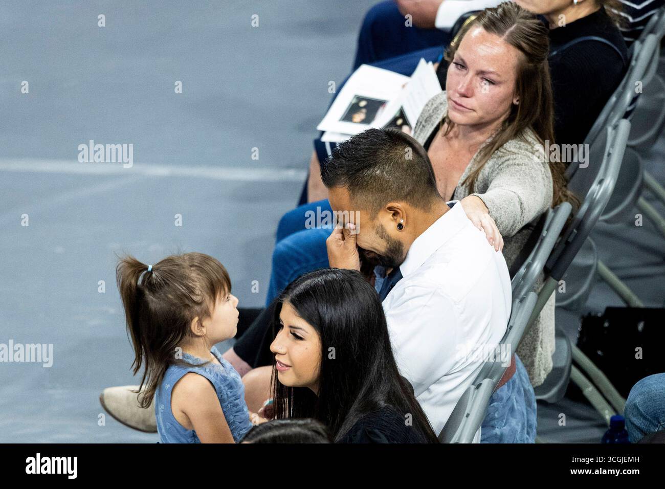 Jesus Estrada holds a hand to his face after speaking during the ...