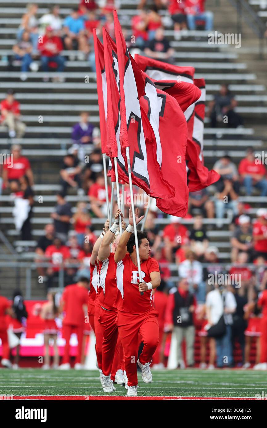 PISCATAWAY, NJ - AUGUST 28: Rutgers Scarlet Knights flag crew runs down ...