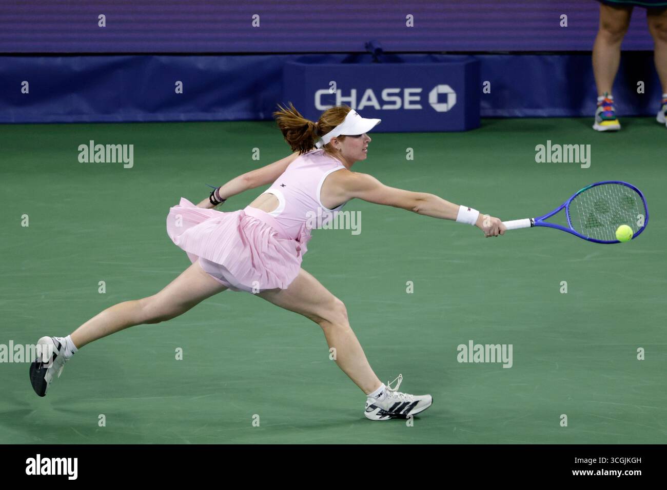 Maya Joint, of Australia, returns a shot to Amanda Anisimova, of the ...