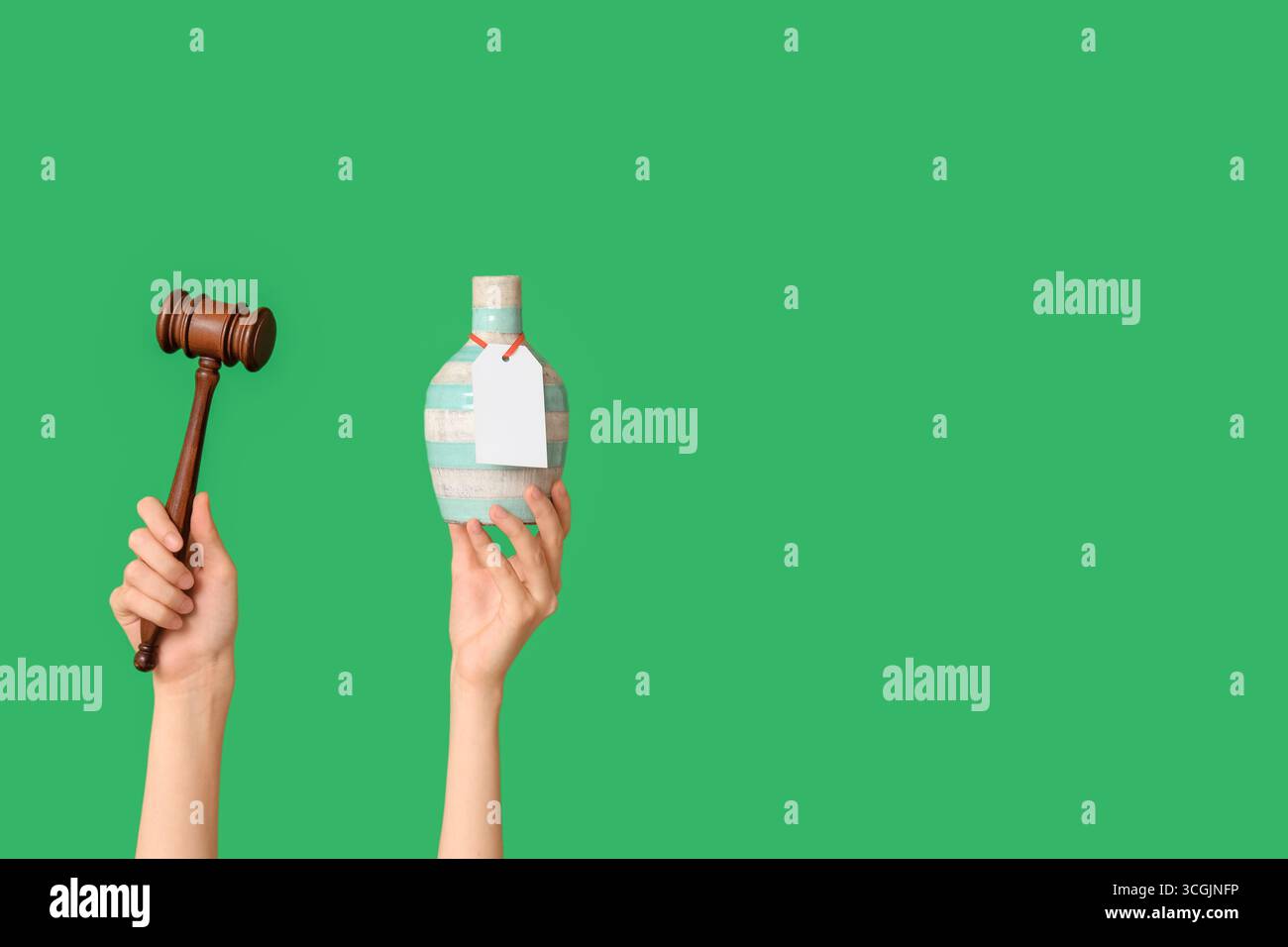 Woman holding auction gavel and antique vase on green background Stock ...