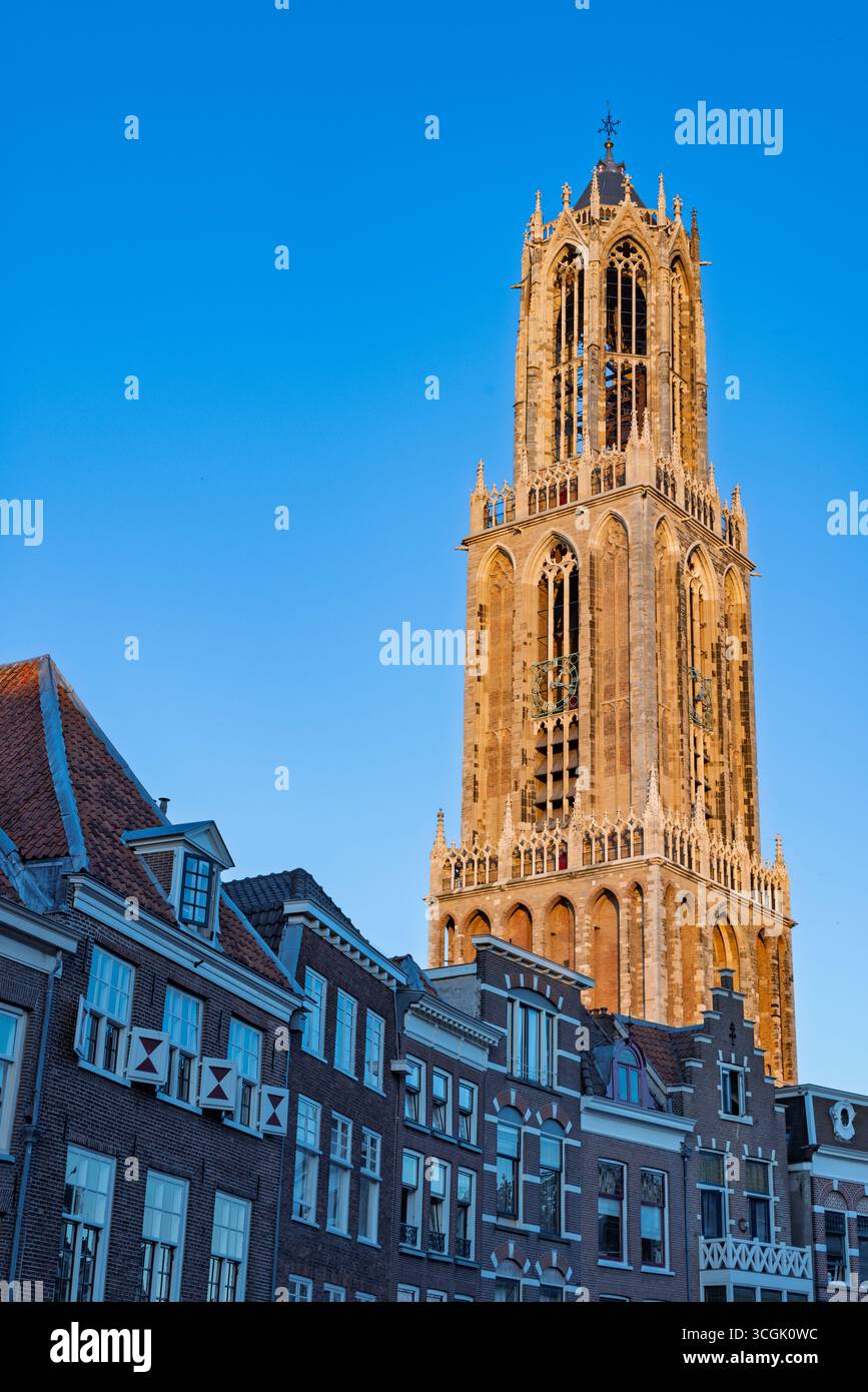 The iconic Dom Tower "Dom toren" of Utrecht stands tall above a row of ...