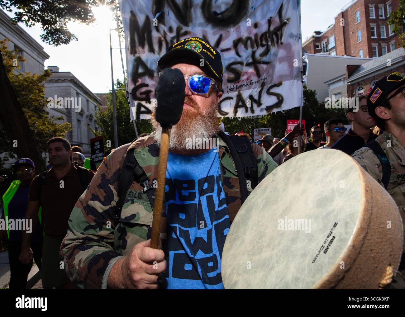 Washington, U.S.A. 28th Aug, 2025. An activist plays drums during a ...